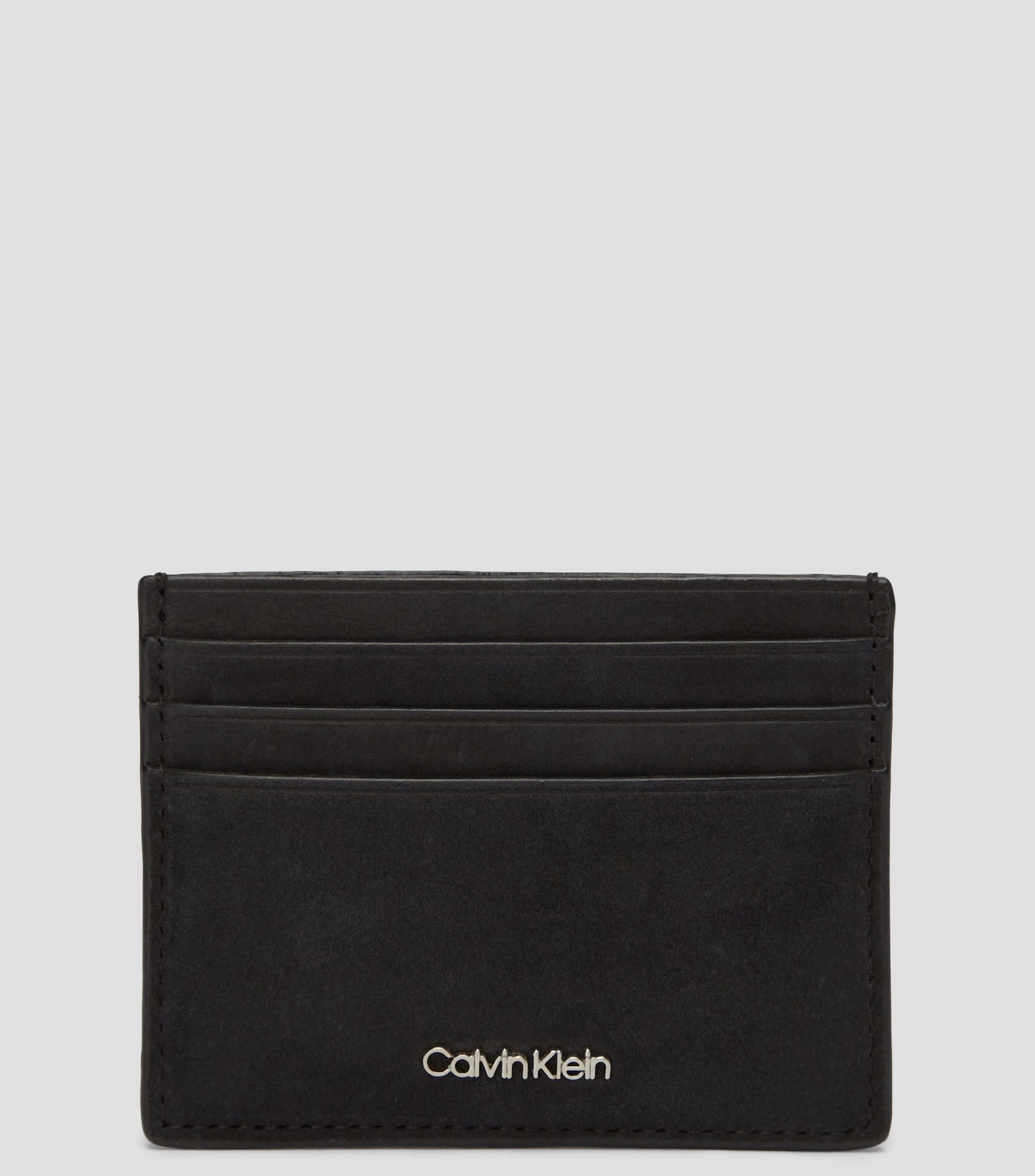 Calvin Klein: Tarjetero en Piel con logo Hombre | El Palacio de Hierro